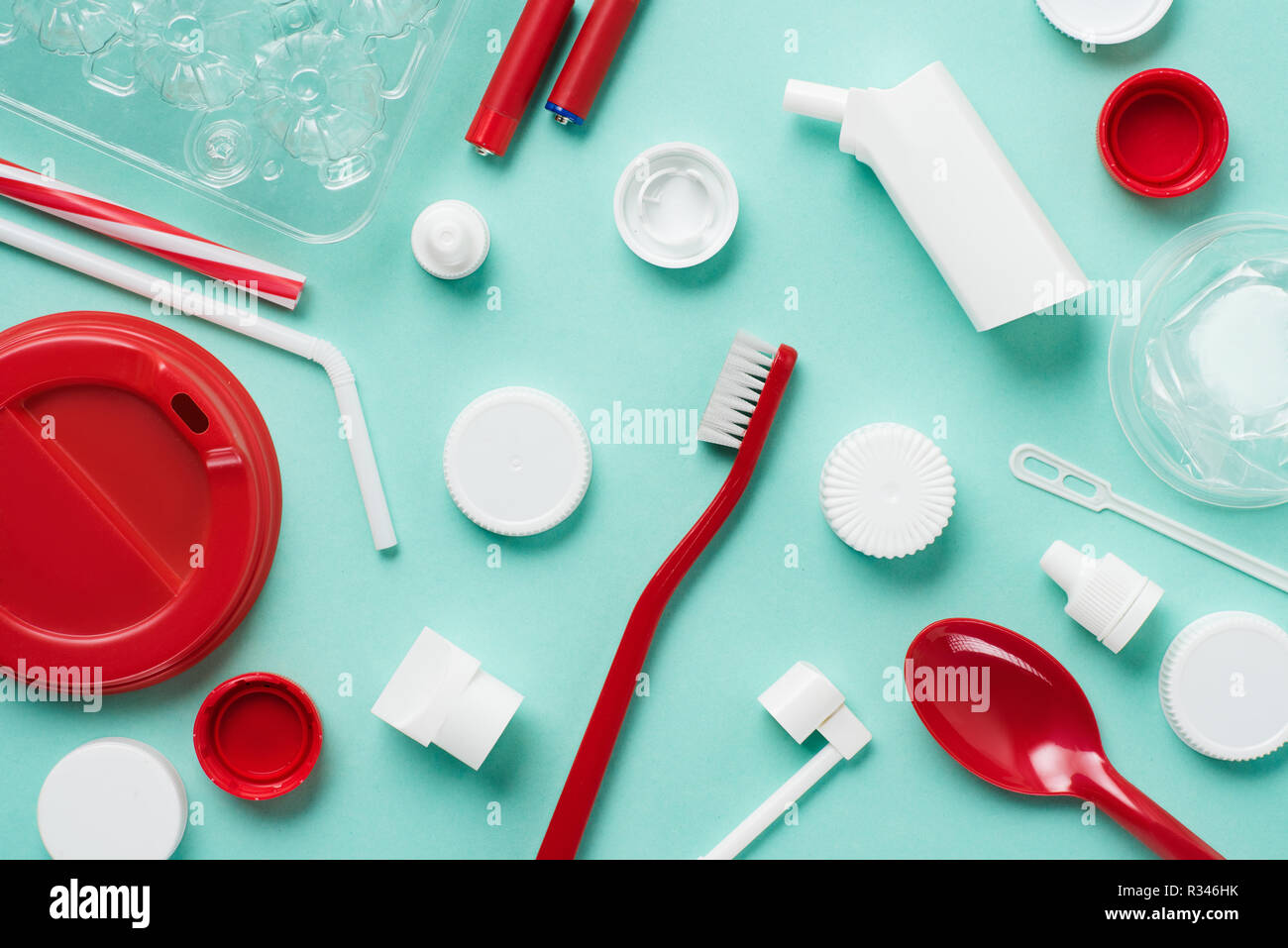 Top view of different kinds of disposable plastic garbage on blue ...