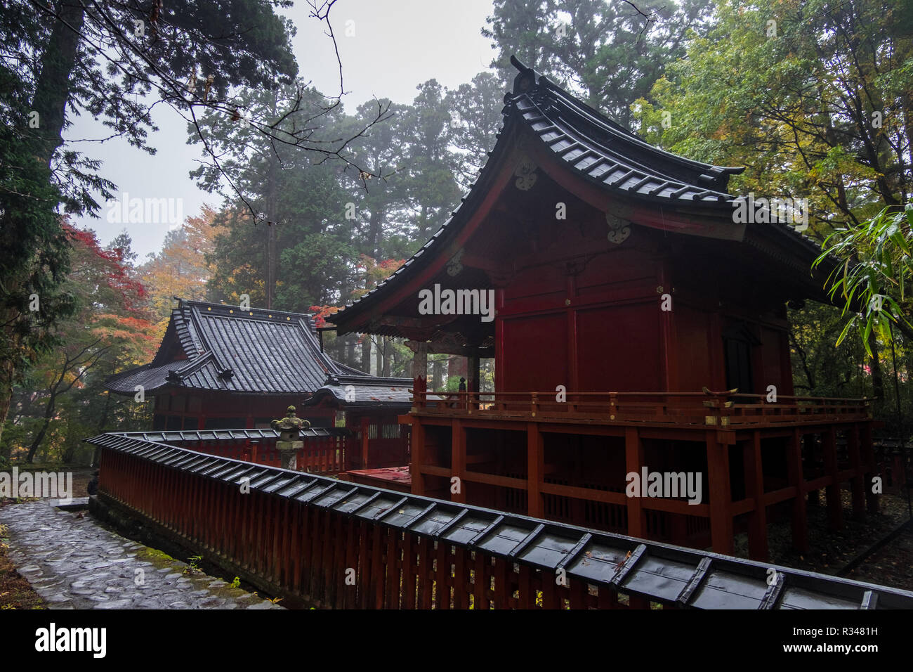 Hongu shrine in Nikko, Japan. A set of red temples with red courtyard ...