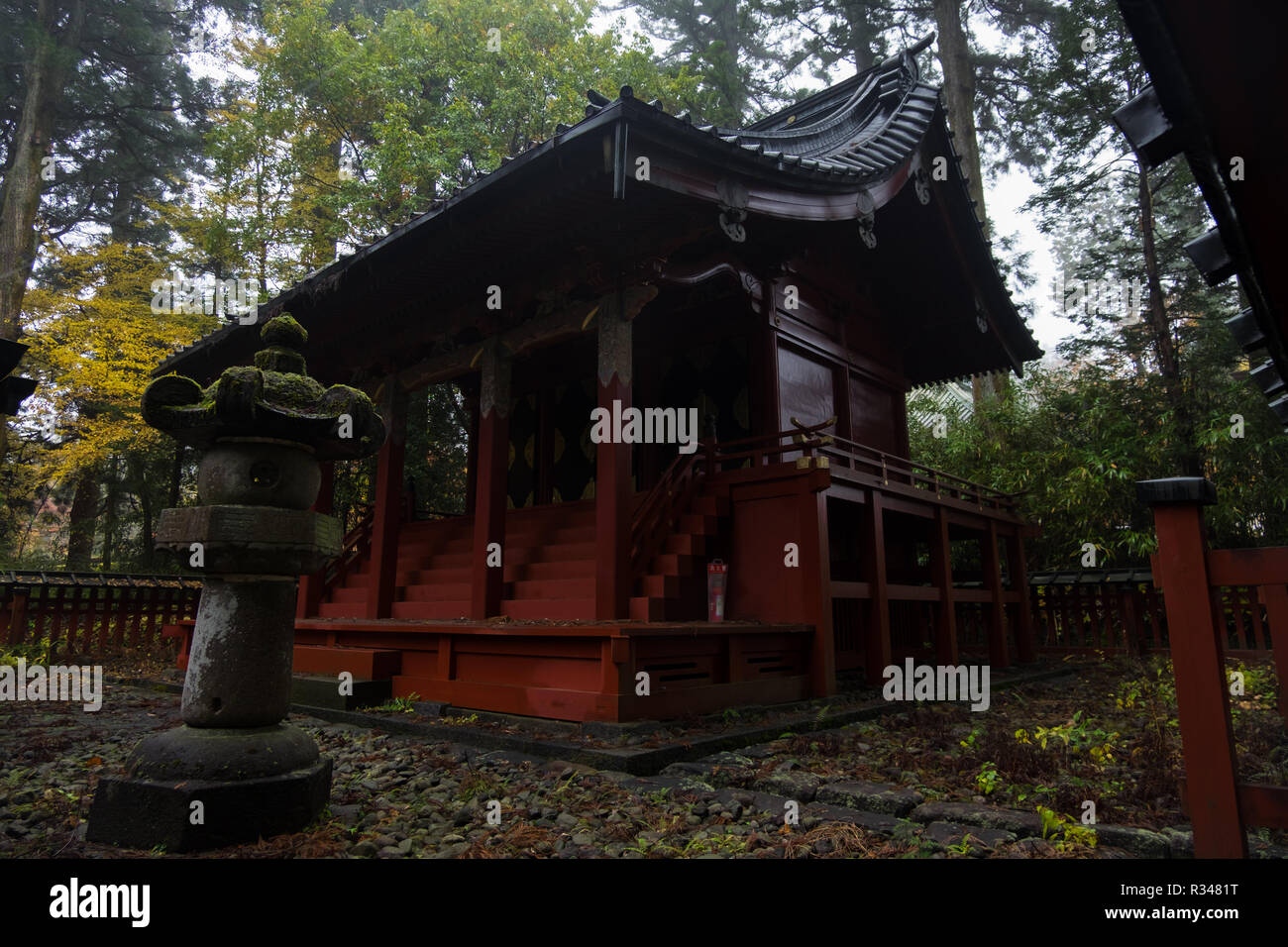 Hongu shrine in Nikko, Japan. A set of red temples with red courtyard ...
