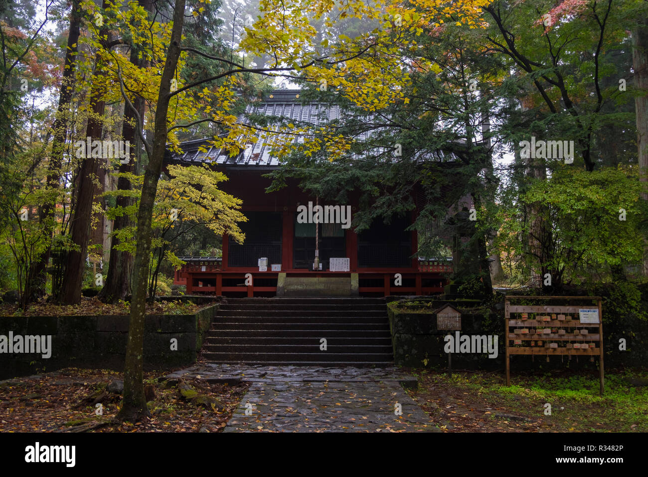 Hongu shrine in Nikko, Japan. A set of red temples with red courtyard ...