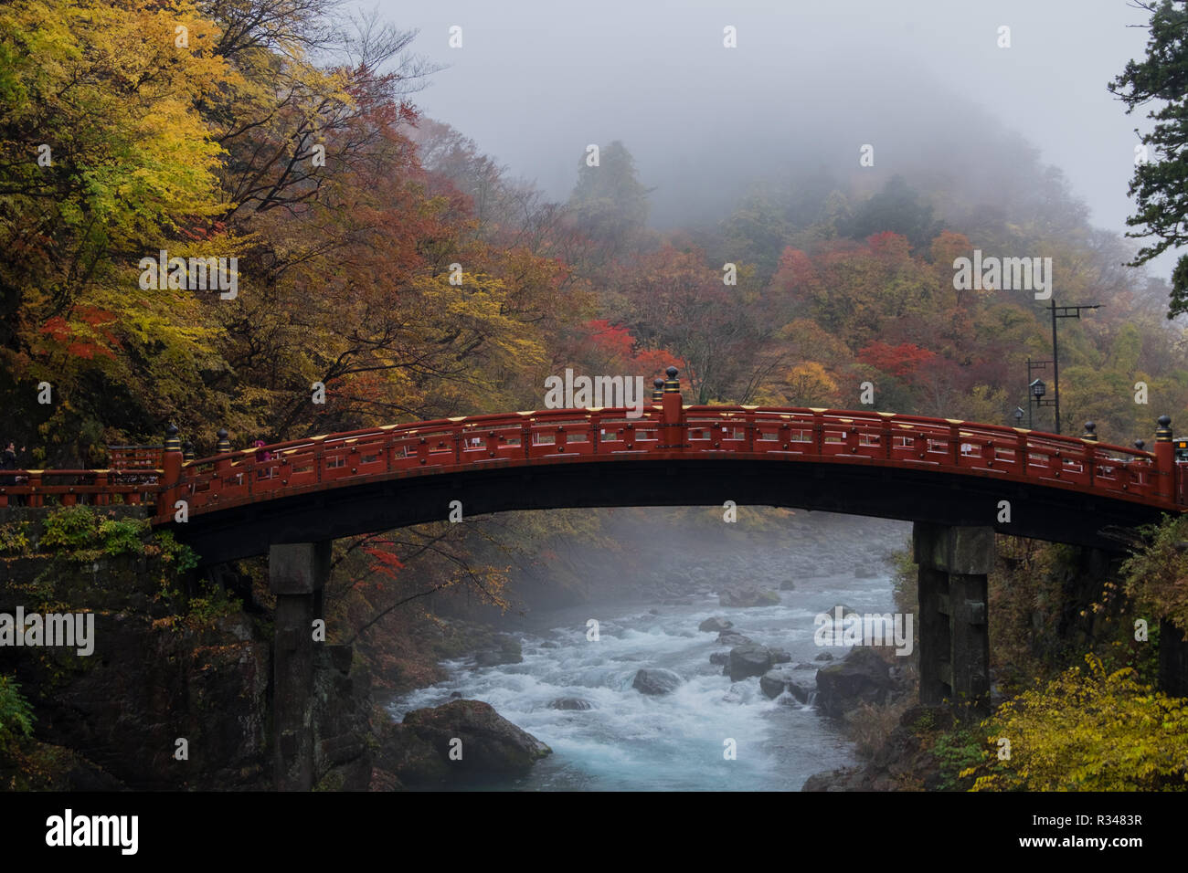 Looking at the beautiful Shinkyo bridge in Nikko, Japan on a misty ...