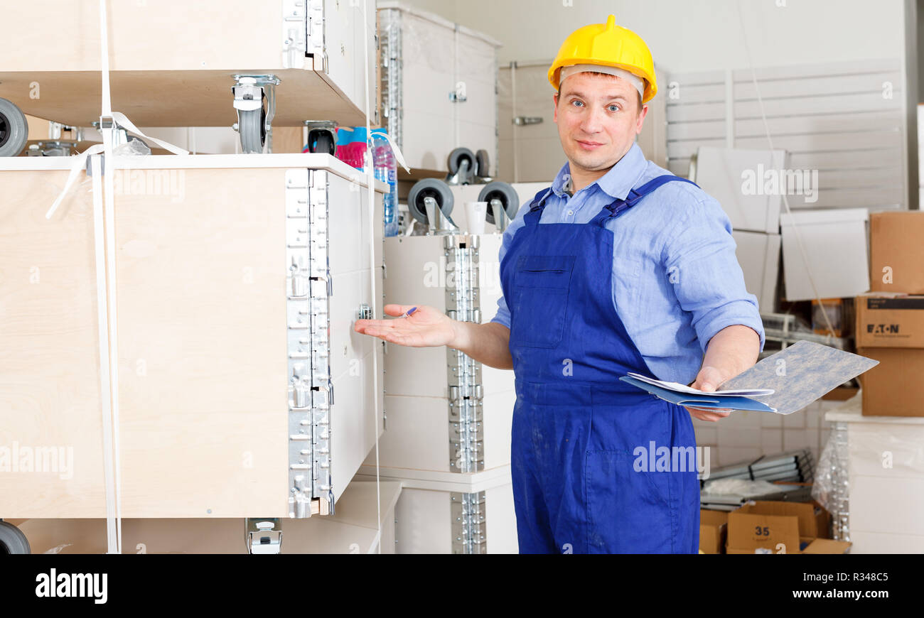 Professional builder getting ready for repair works indoors, making ...
