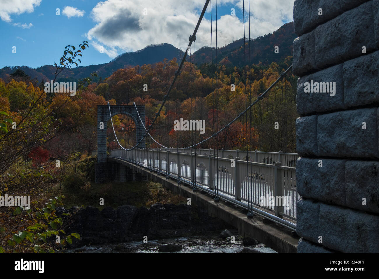 A pedestrian suspension bridge crossing the Daiya river in Nikko, Japan ...