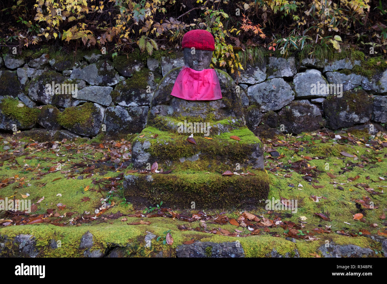 Sacred Jizo statues line a path along the banks of the Daiya river ...