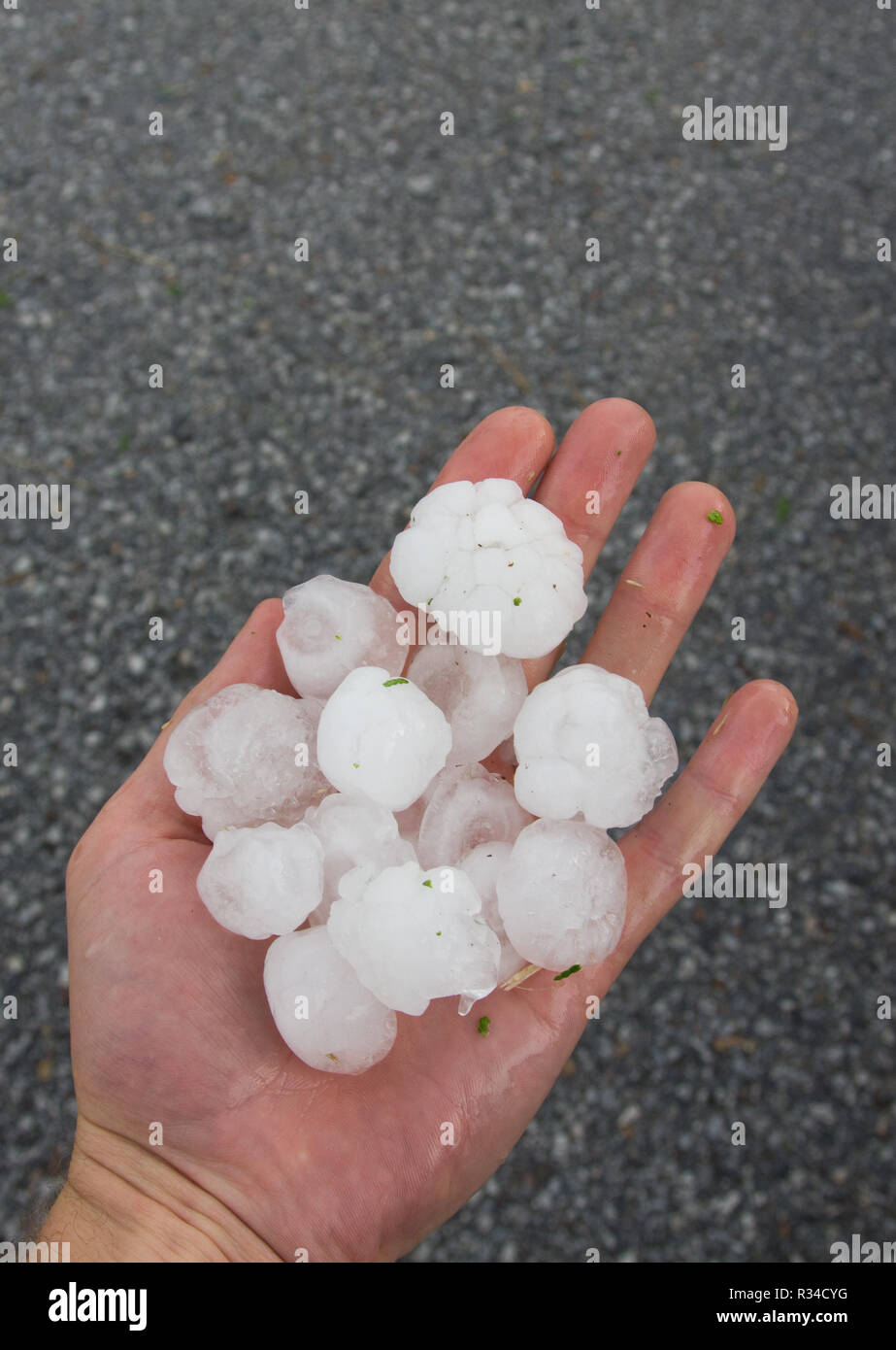 Hand large ball hail hi-res stock photography and images - Alamy
