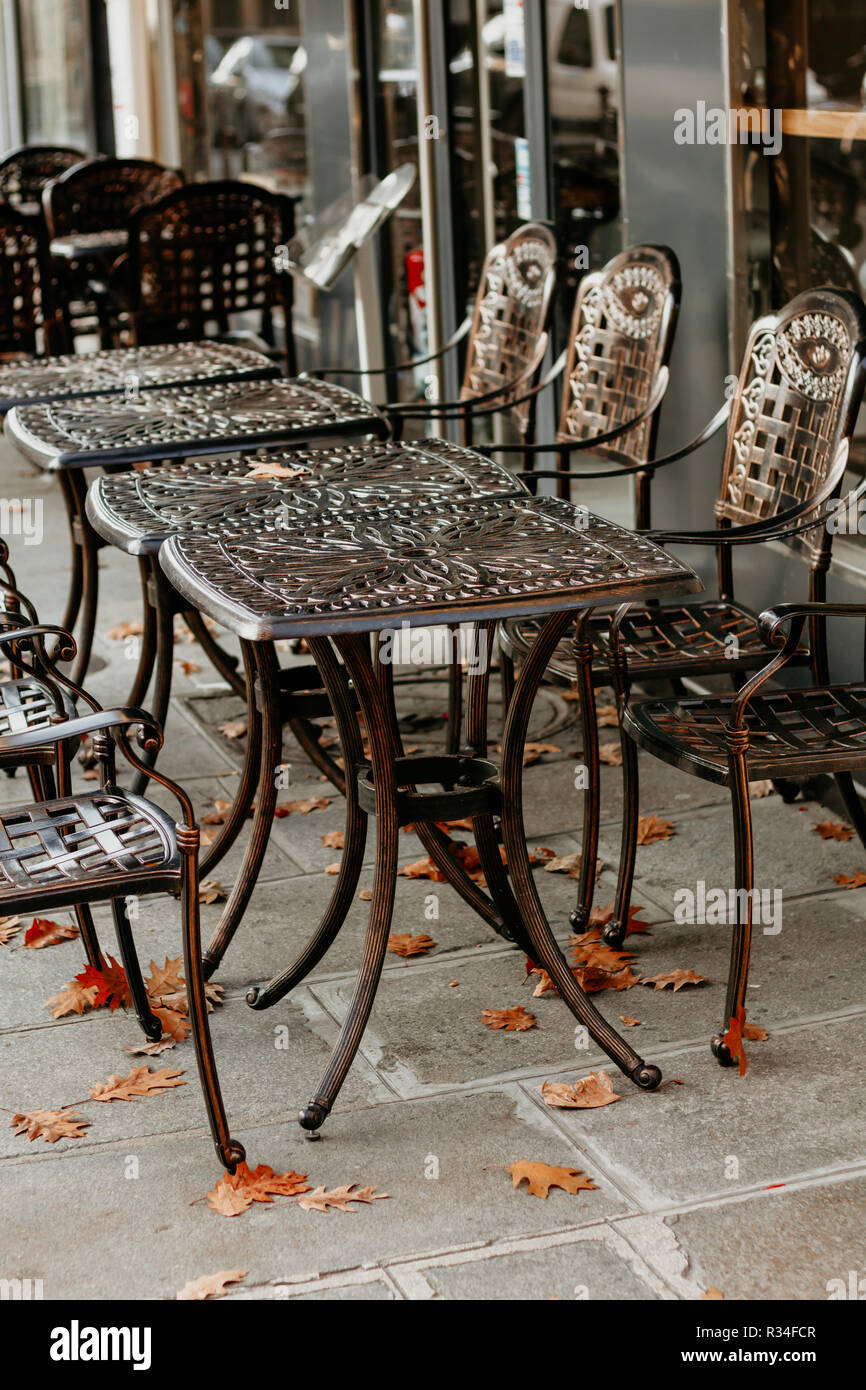 View on a French cafe terrasse in Paris in Autumn Stock Photo - Alamy