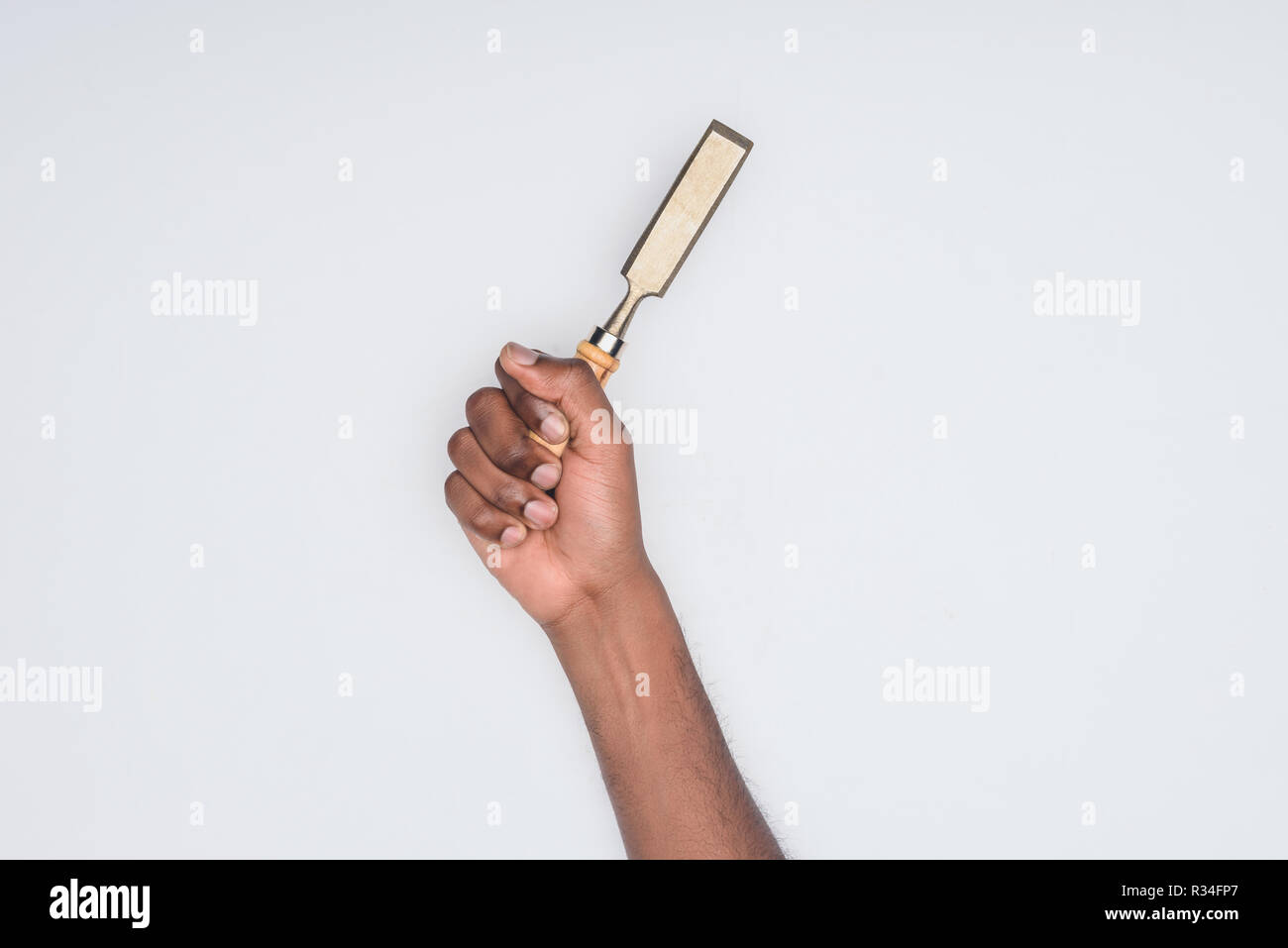 Hand holding chisel hi-res stock photography and images - Alamy