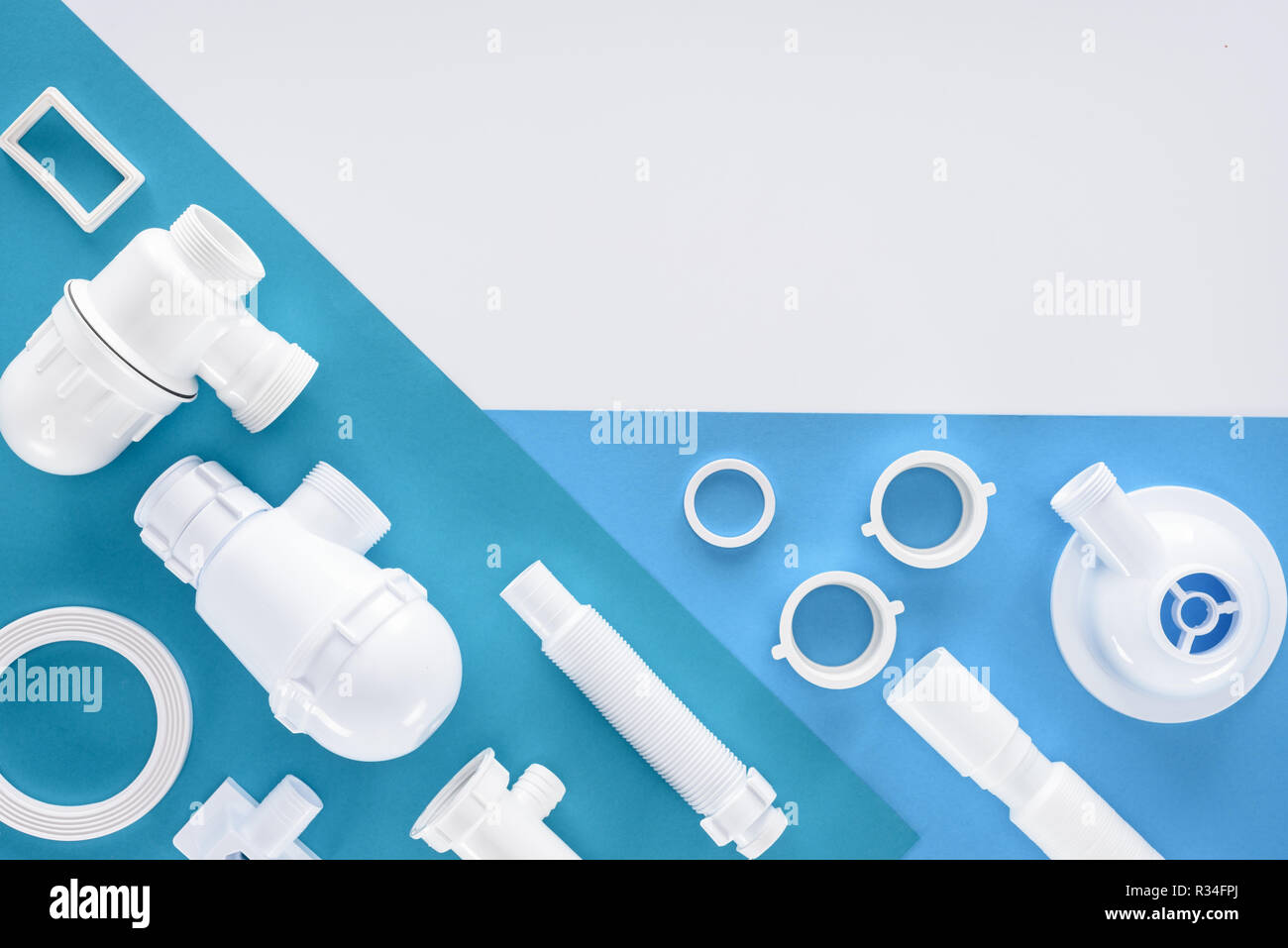 top view of plastic plumbing pieces isolated on white Stock Photo - Alamy