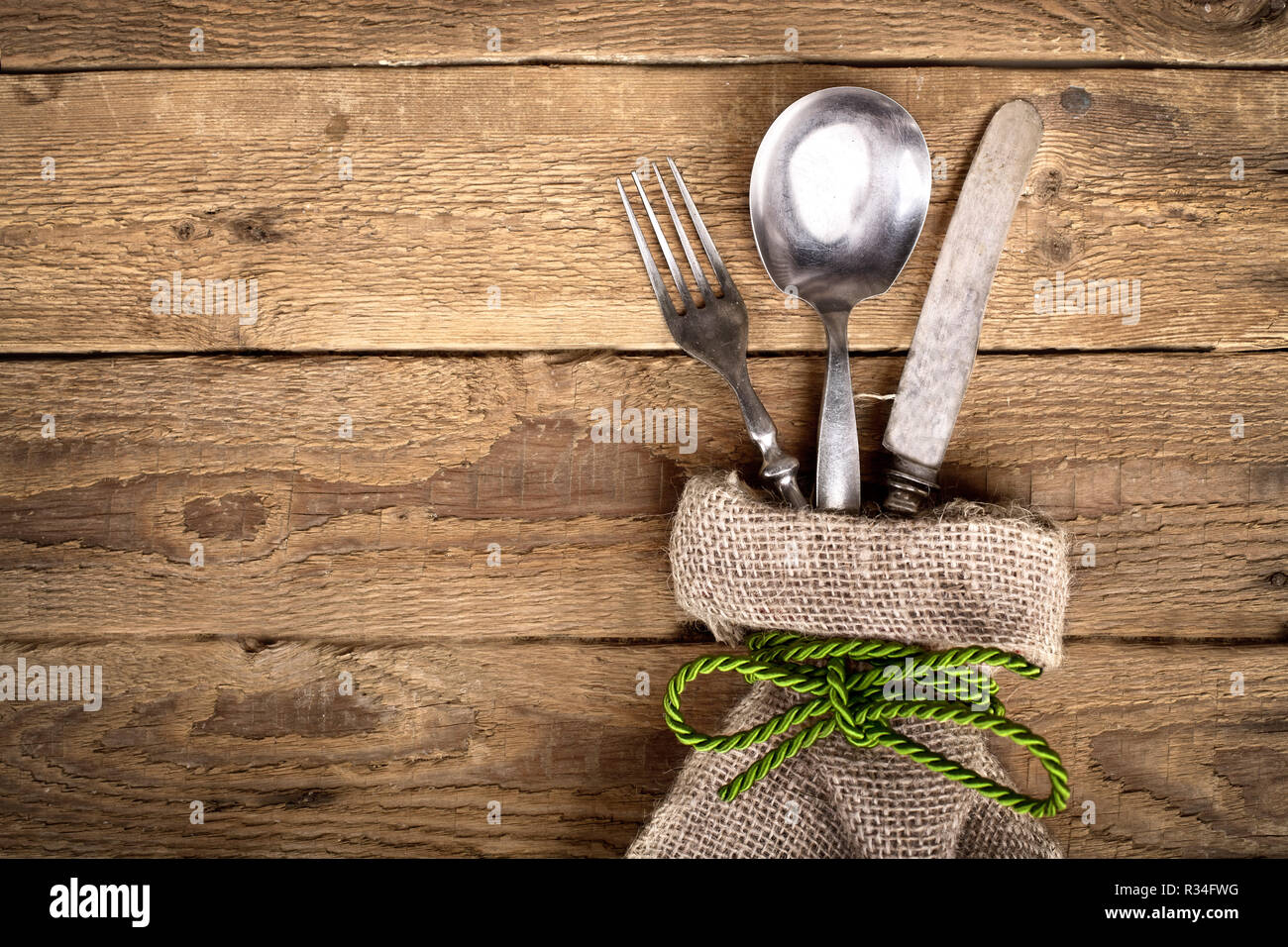 rustic cutlery in linen bag Stock Photo - Alamy