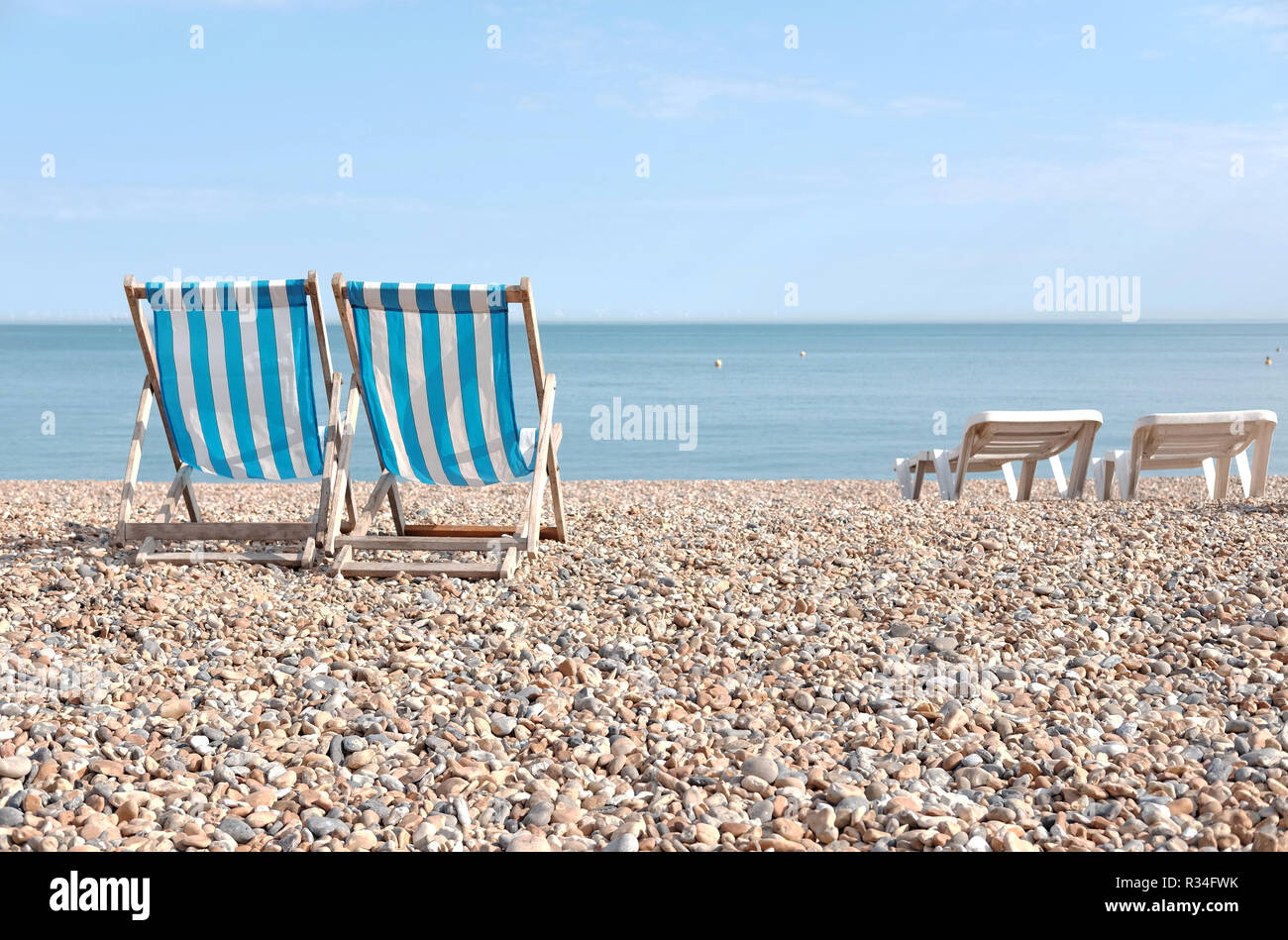 Timber beach chairs on Brighton Beach, England Stock Photo - Alamy