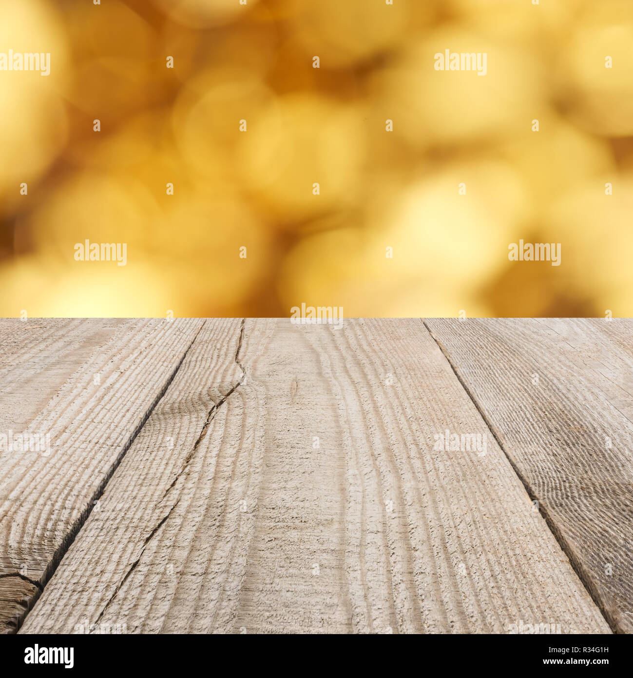 surface of beige wooden planks with blurry golden background Stock ...