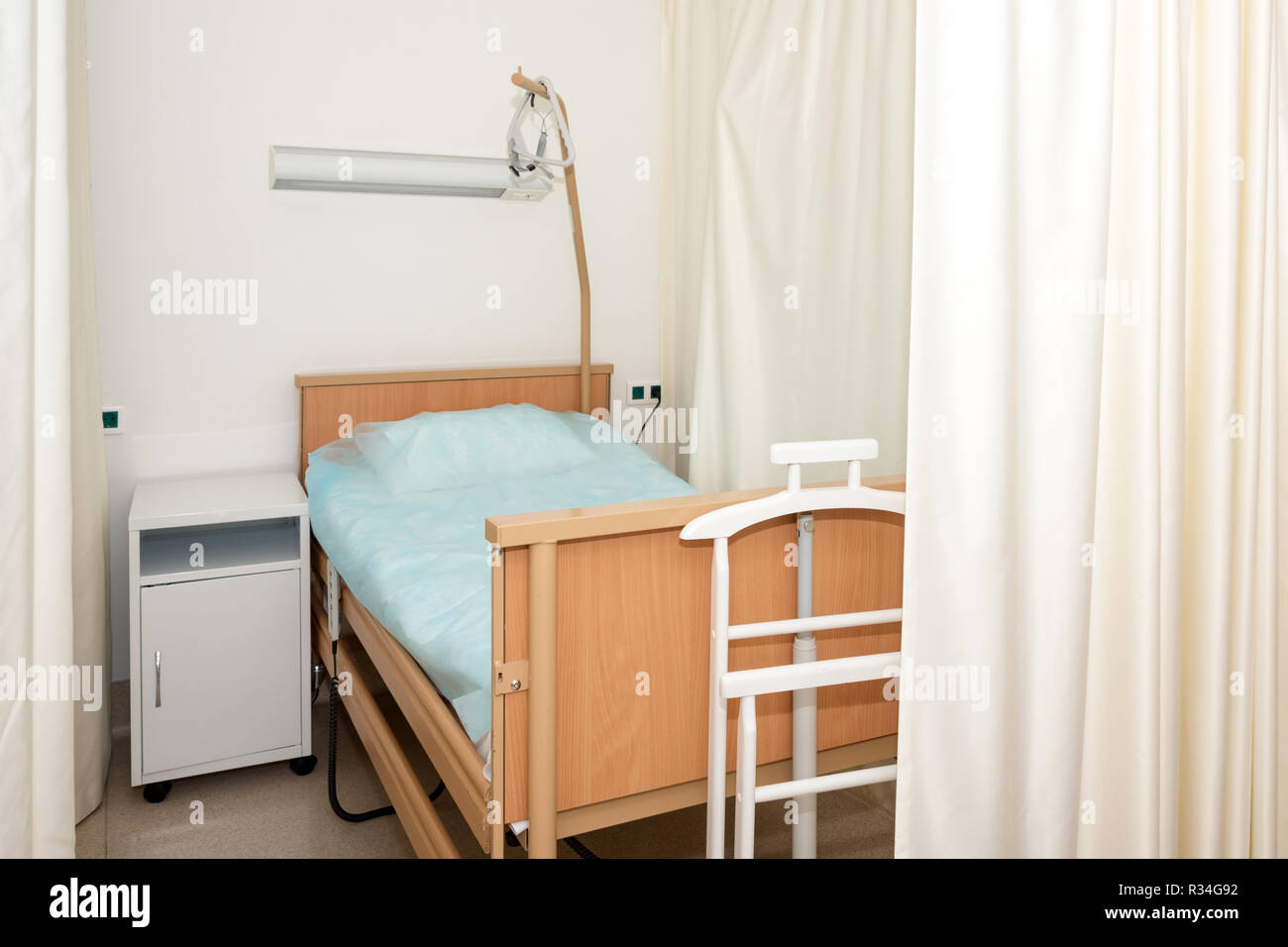 Patient room in clinic. Hospital ward with bed and medical equipment ...