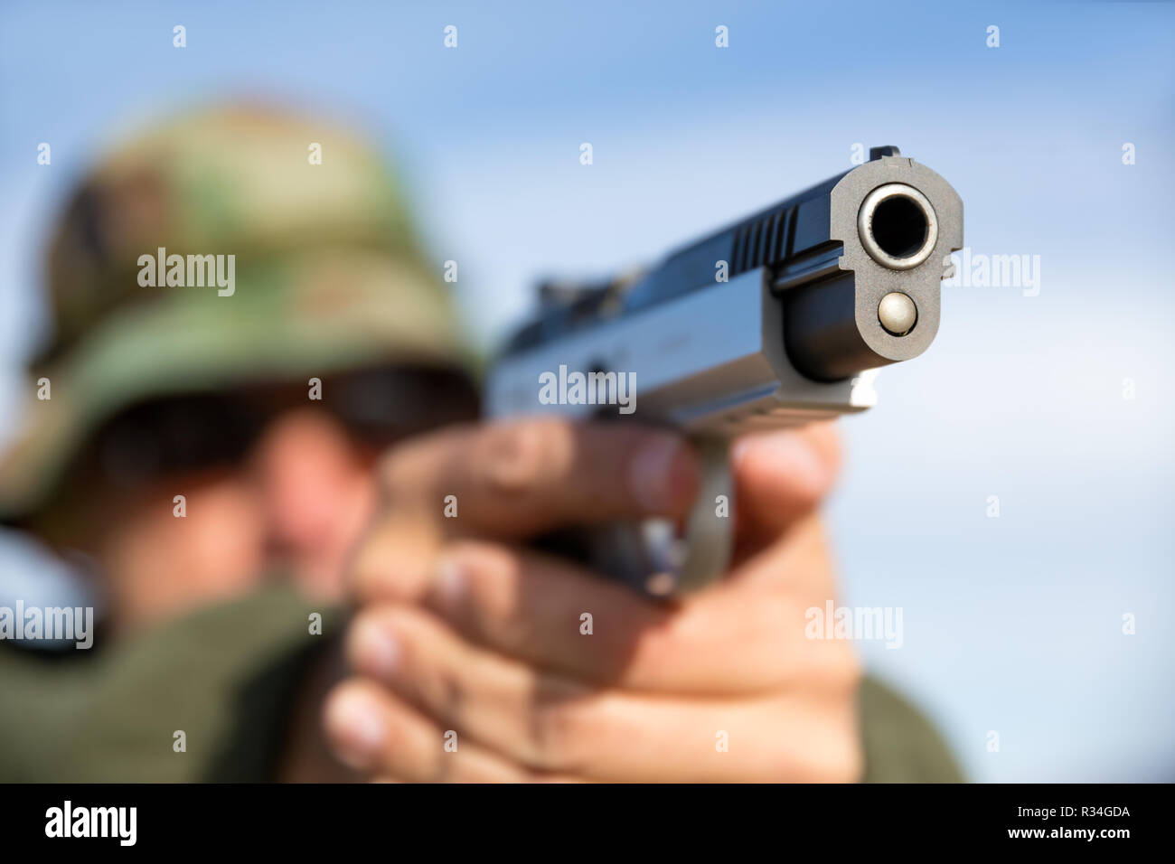 Hands With Gun High Resolution Stock Photography and Images - Alamy