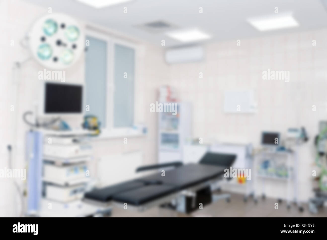 Equipment and medical devices in modern operating room. Blurred ...