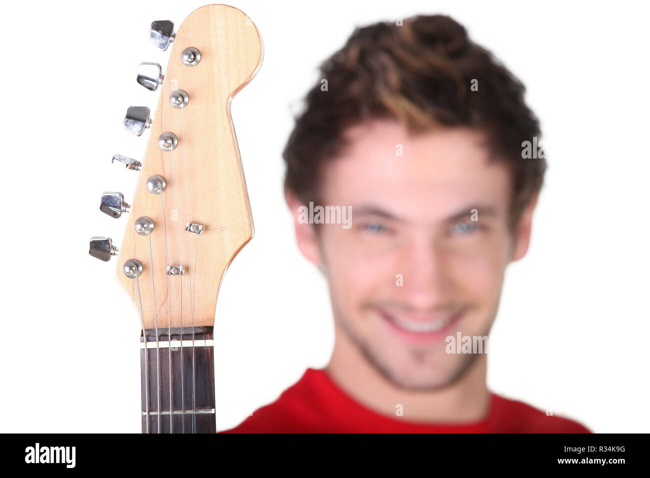 Red electric guitar played hi-res stock photography and images - Alamy