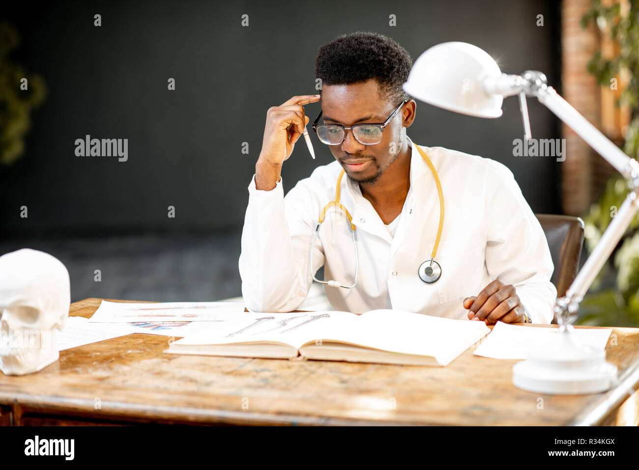 Portrait of a young african ethnicity physician or medical student in ...