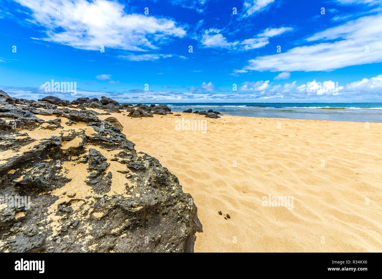 Large rocks along a beach in Kauai, Hawaii Stock Photo - Alamy