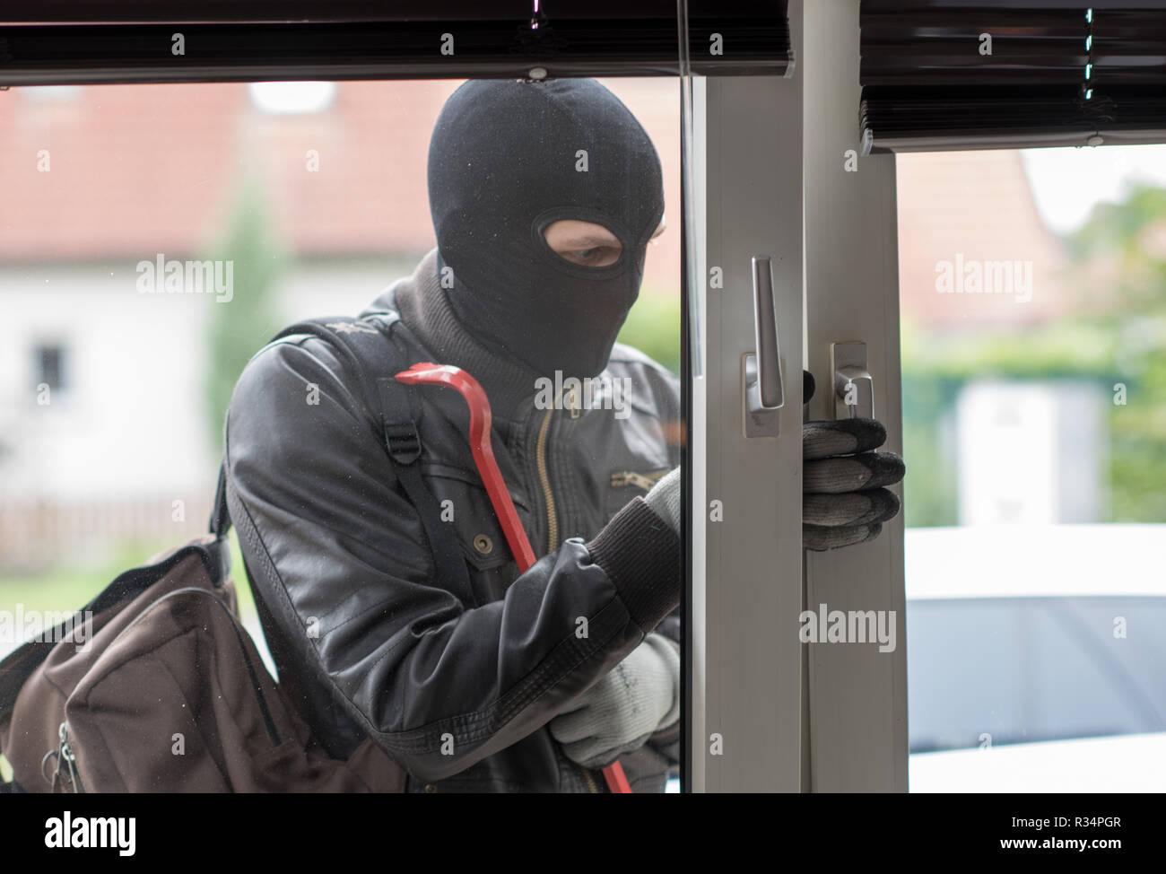 burglar with crowbar Stock Photo - Alamy