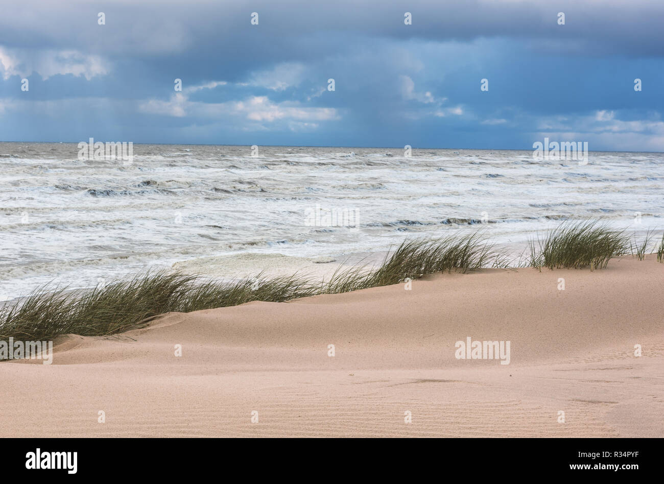 Storm over an ocean and sand dune - nature seascape background Stock ...