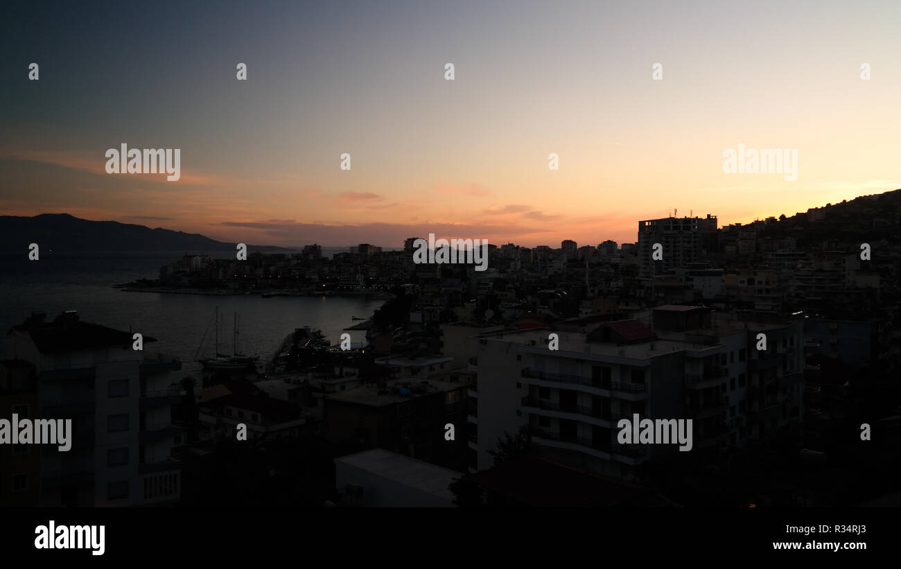 sunset Aerial Panoramic view to Saranda city and bay of Ionian sea in ...