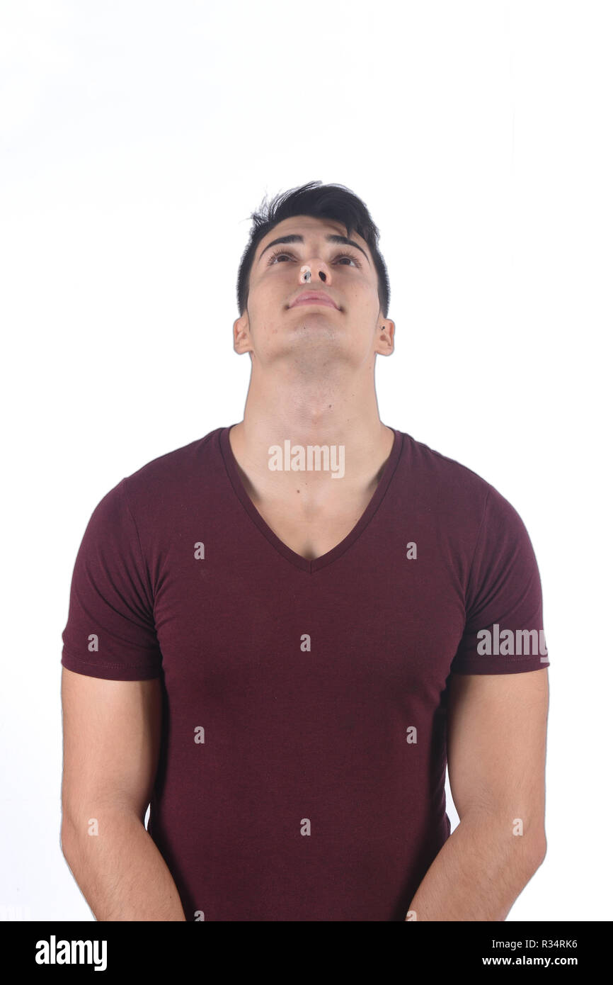 portrait of a young man look up on white background Stock Photo - Alamy