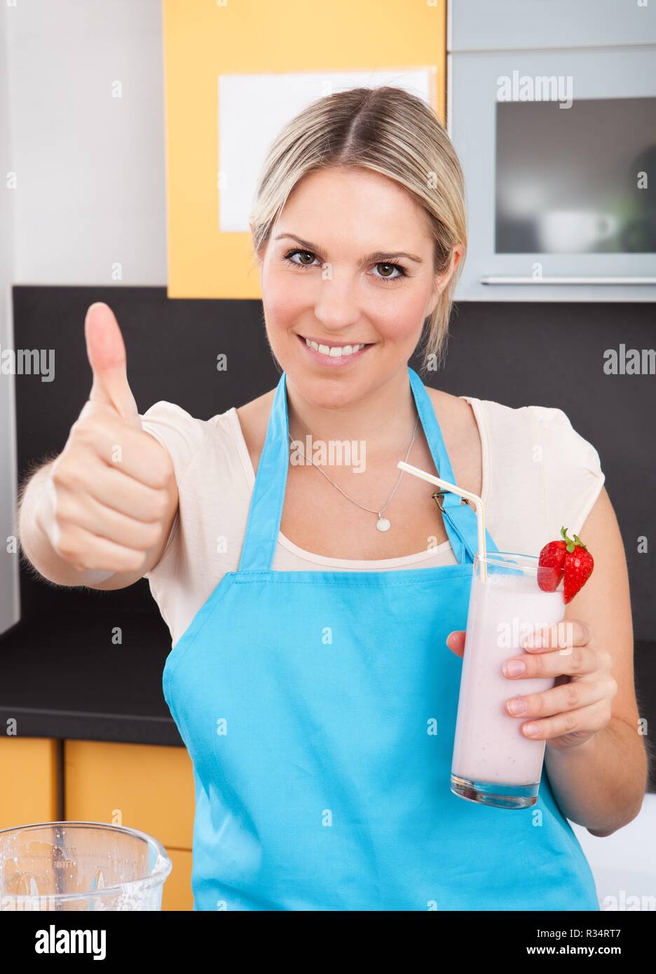 Beautiful woman drinking pink milkshake hi-res stock photography and ...