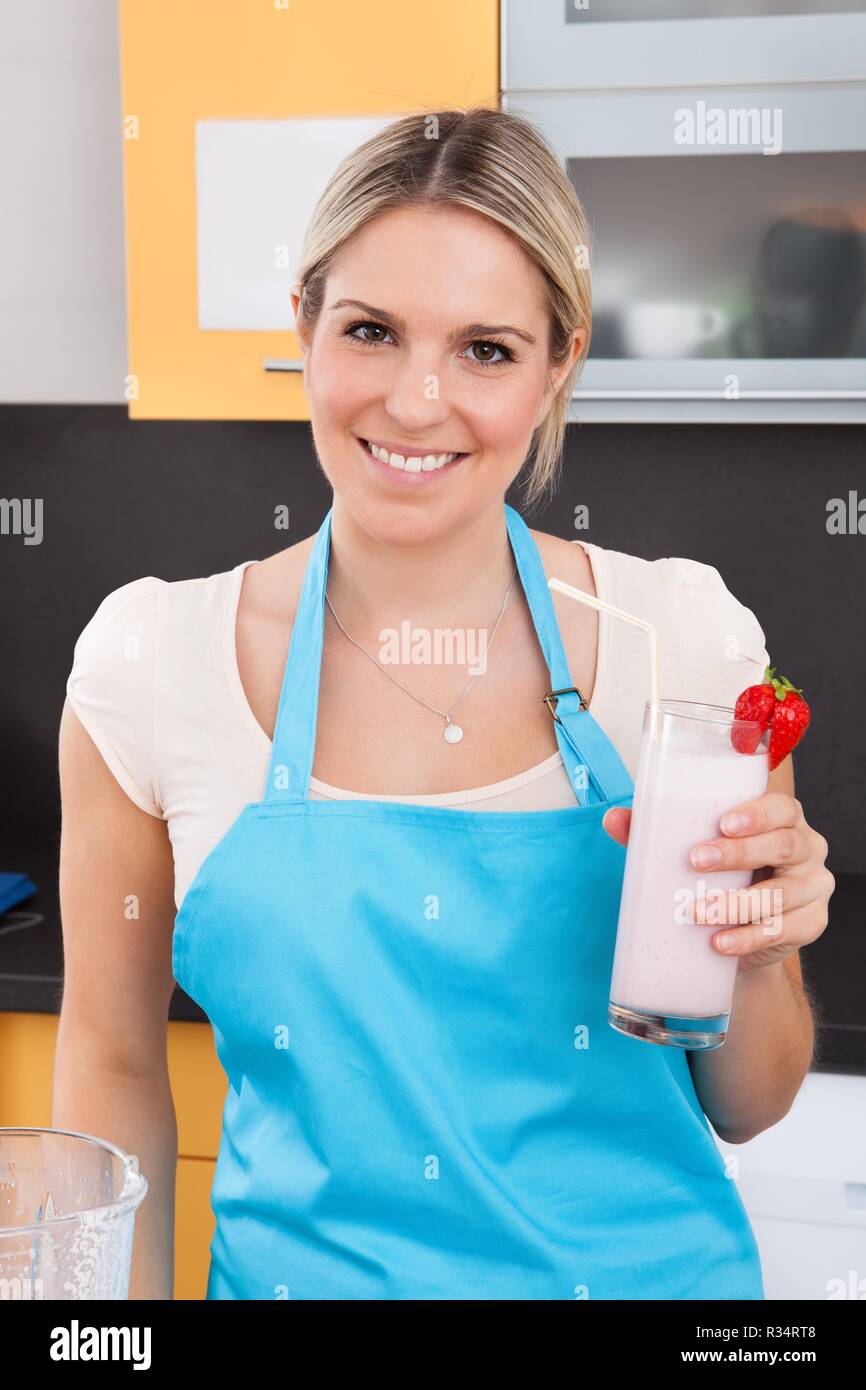 Beautiful woman drinking pink milkshake hi-res stock photography and ...