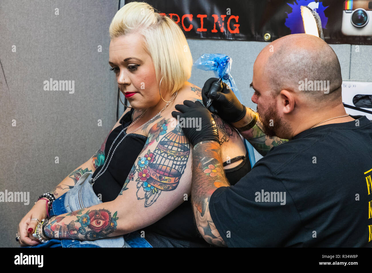 England, London, Wapping, Tobacco Dock, London Tattoo Convention, Woman ...
