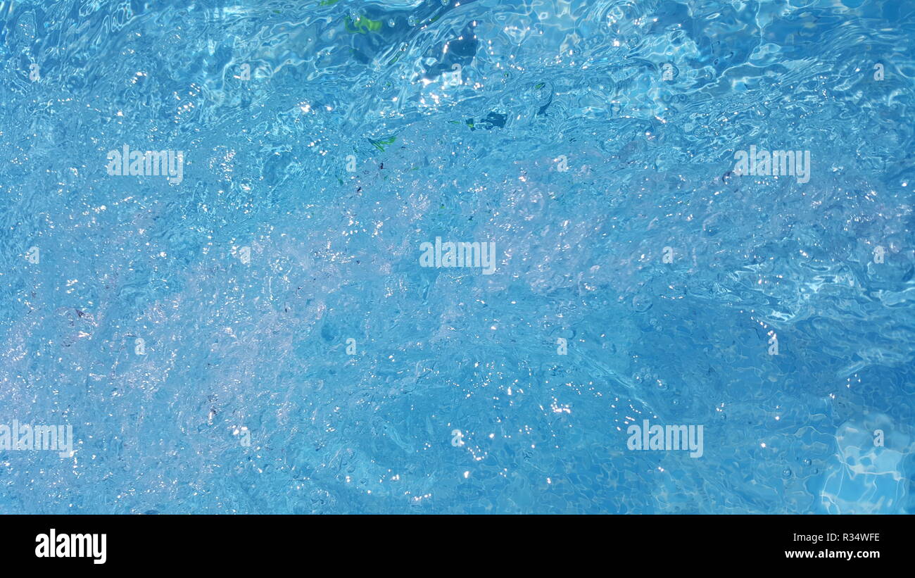 Pool water stirred in summer Stock Photo - Alamy