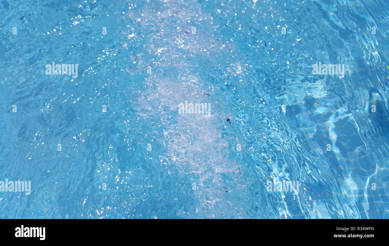 Pool water stirred in summer Stock Photo - Alamy