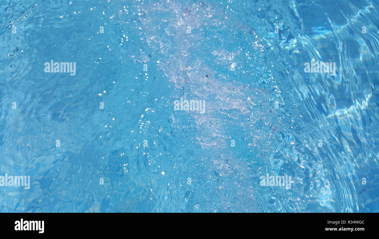 Pool water stirred in summer Stock Photo - Alamy