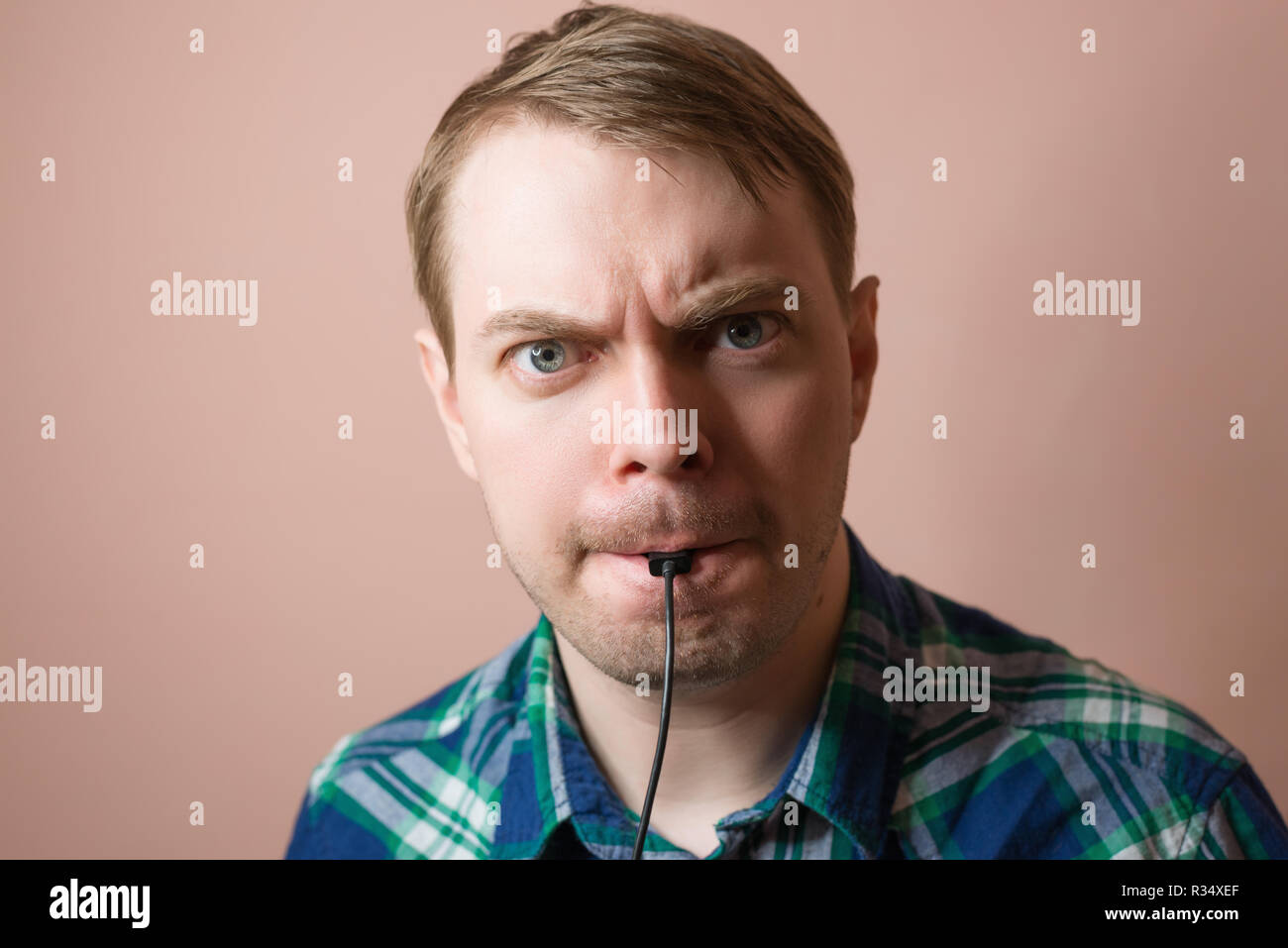 Man busy plugging hi-res stock photography and images - Alamy