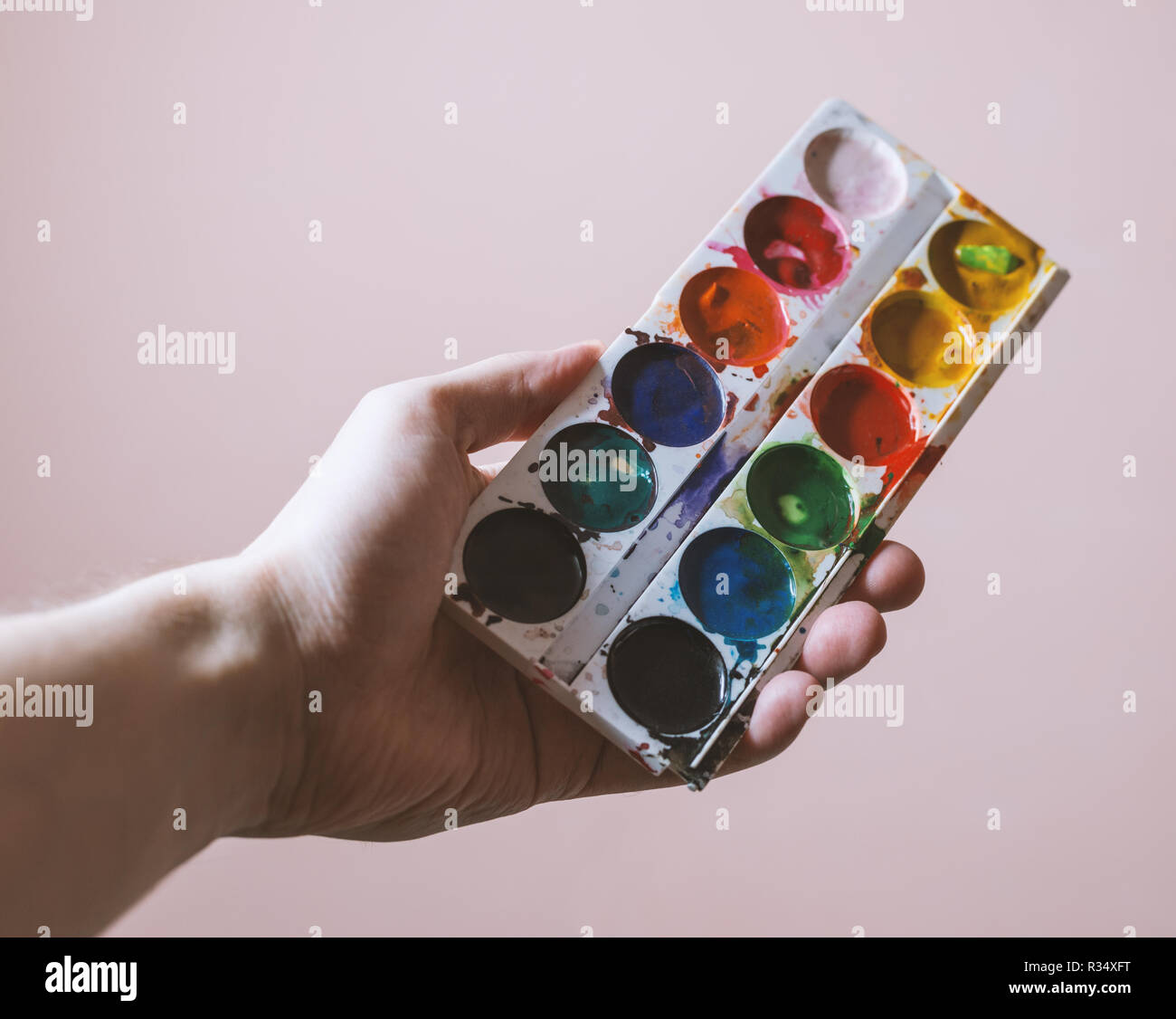 Watercolor paint box in man hand Stock Photo - Alamy