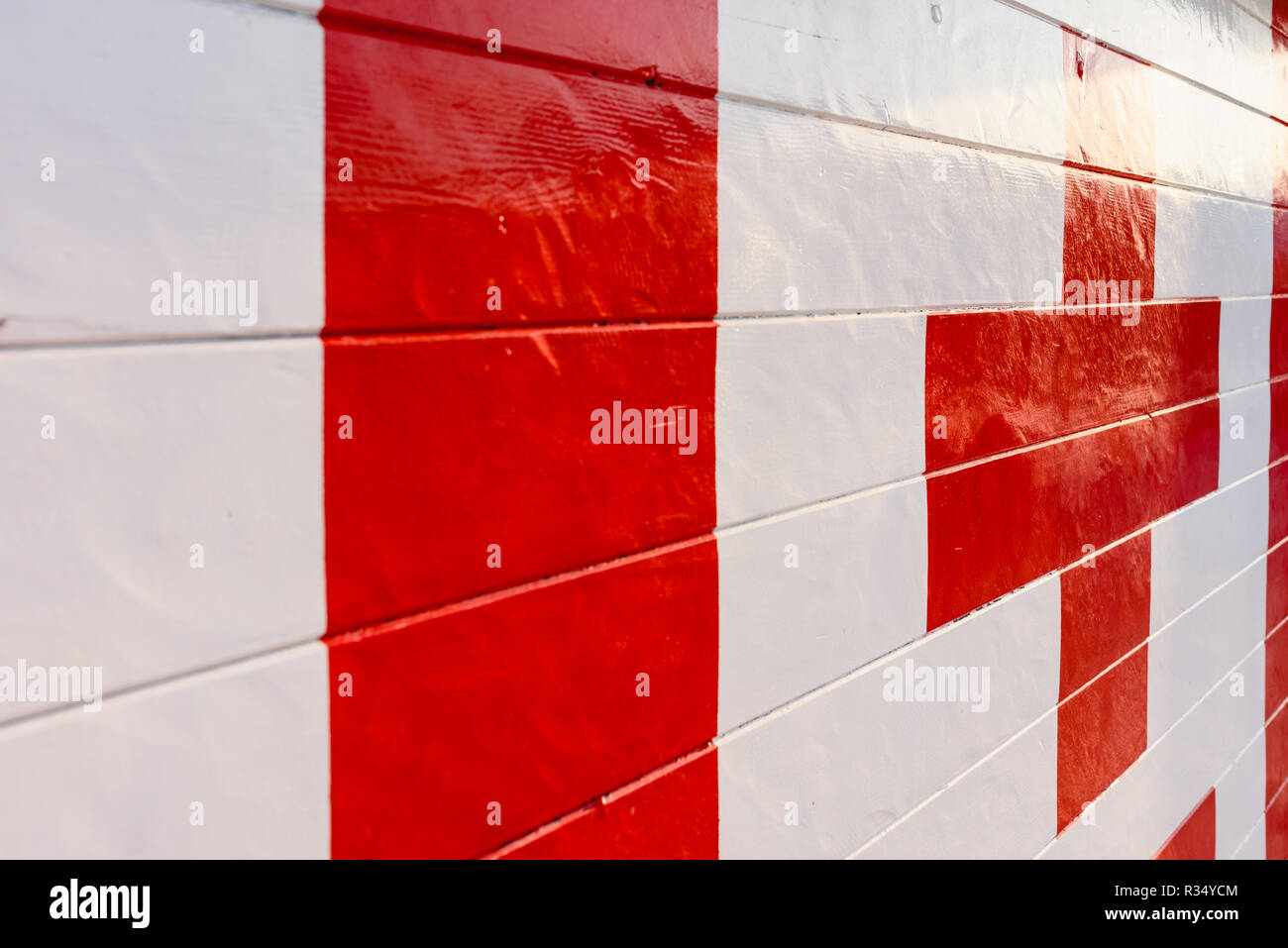 Detail of a painting of red lines on white wooden table Stock Photo - Alamy