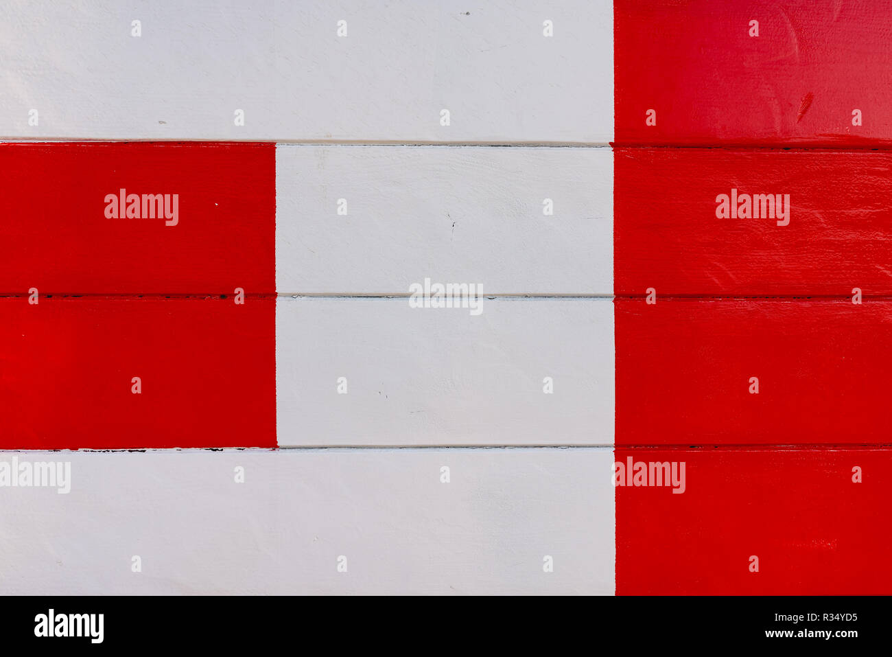 Detail of a painting of red lines on white wooden table Stock Photo - Alamy