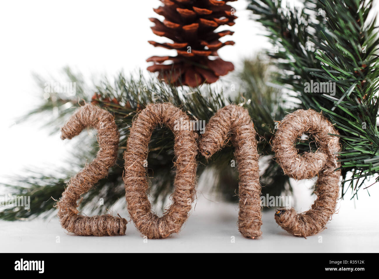 Christmas and happy new year decor with pine and 2019 numbers on white ...