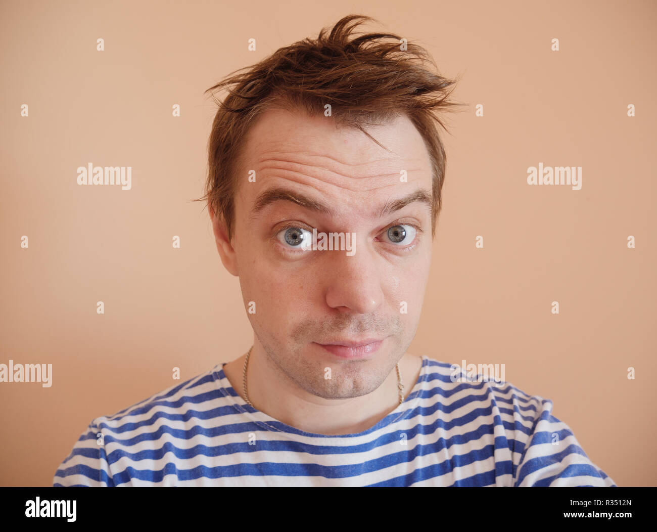 Portrait of a sleepy young man Stock Photo - Alamy