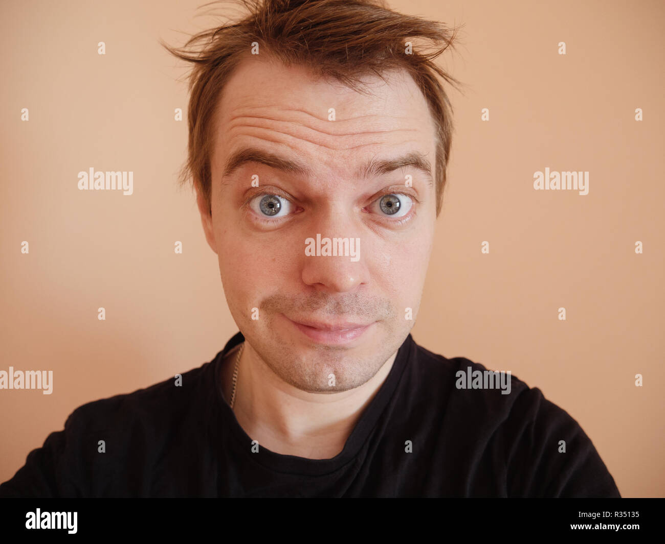 Portrait of a sleepy young man Stock Photo - Alamy
