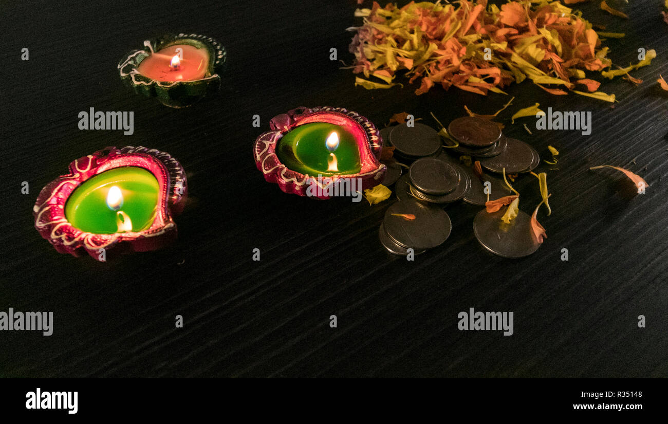 Lit diya placed on flower hi-res stock photography and images - Alamy