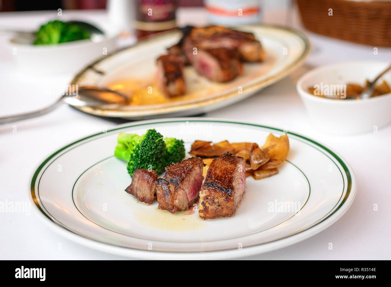USDA Prime Petit Filet Mignon with sauteed onions and broccolli Stock ...