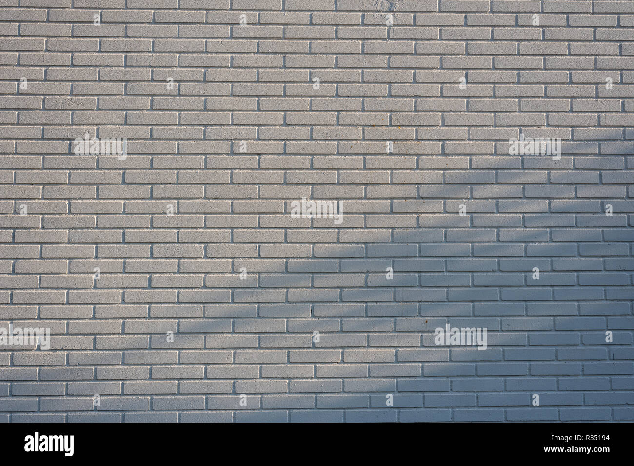 White brick wall with textures at sunset Stock Photo - Alamy