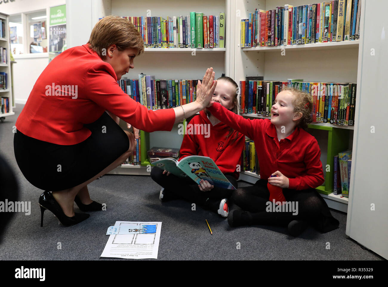 First Minister Nicola Sturgeon high fives Faith Cole alongside Nicole ...