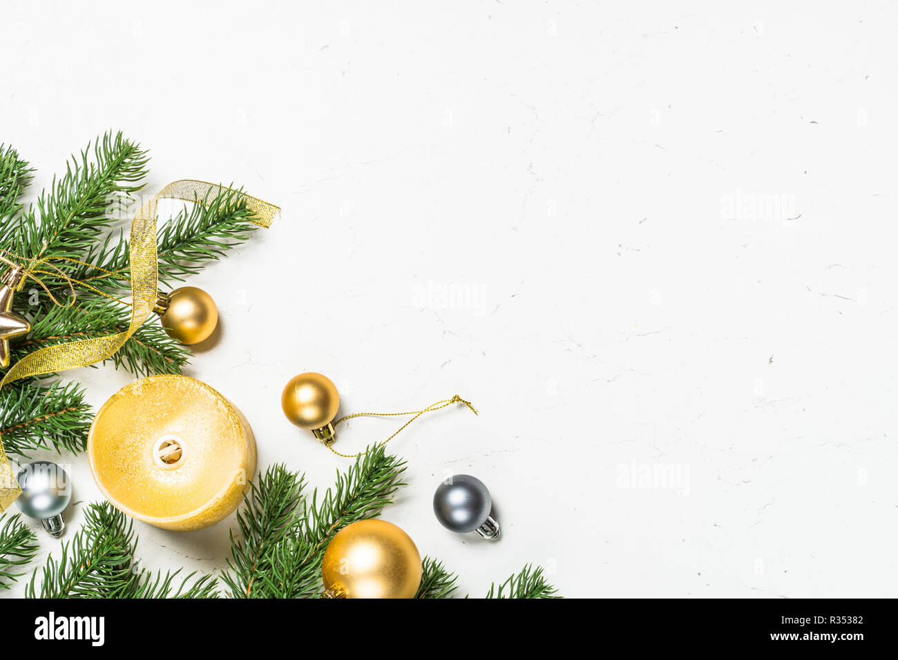 Gold candle and decorations with fir tree on white background Stock ...