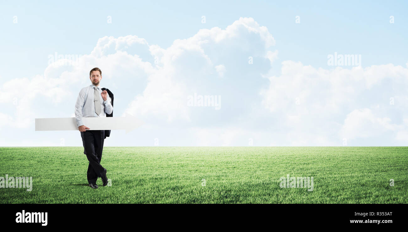Conceptual image of businessman pointing aside Stock Photo - Alamy