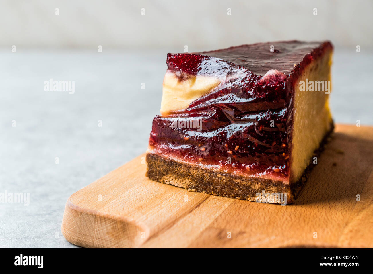 Raspberry Cheesecake Slice on Wooden Board with Paper. Organic Dessert ...