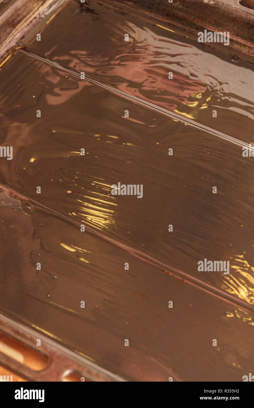 Oiled metal black baking tray with vegetable oil Stock Photo - Alamy