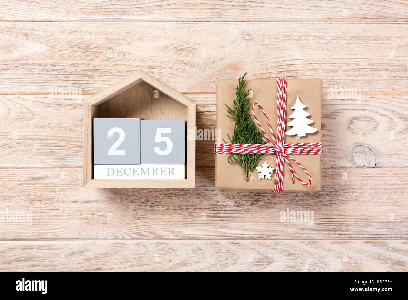 Calendar with date 25 december and gift boxes on color background ...