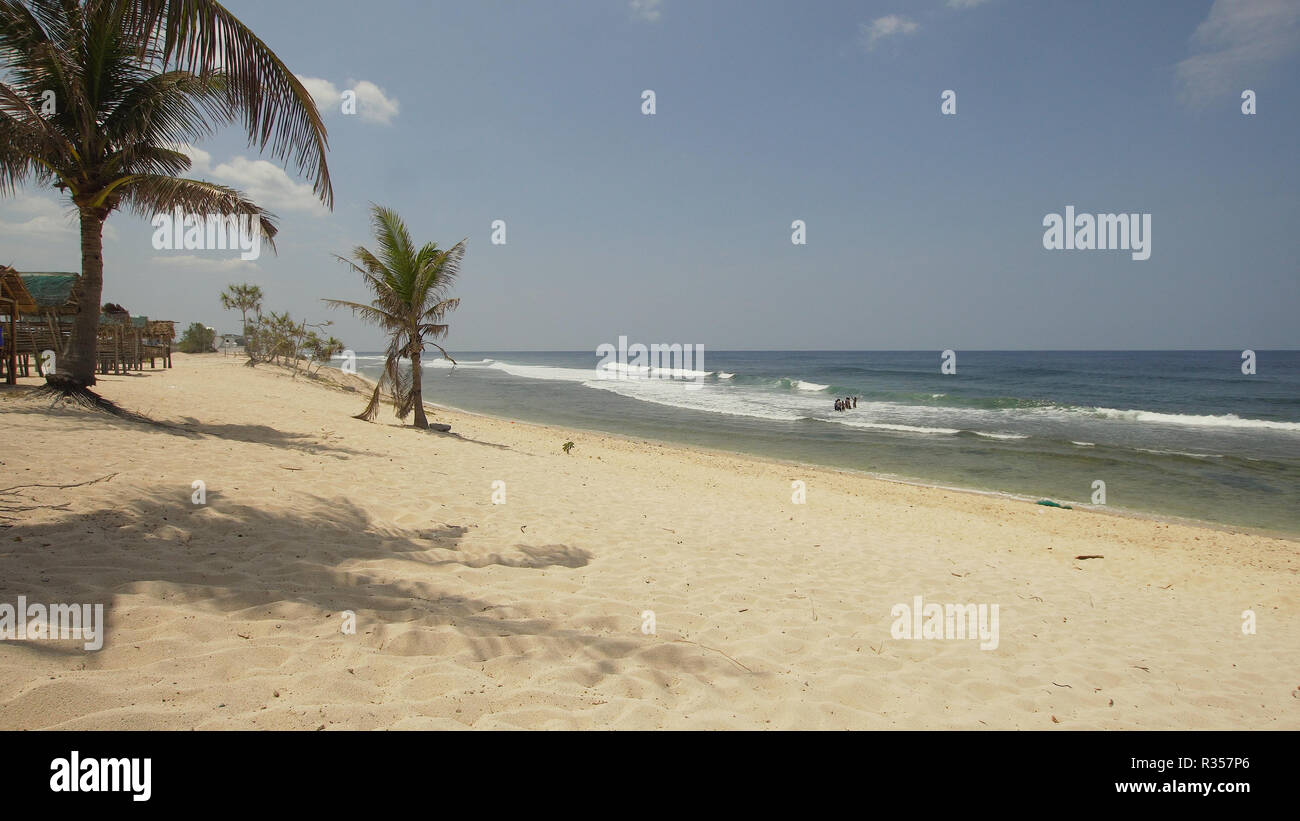 Tropical island with white sandy beach in blue lagoon, palm tree ...