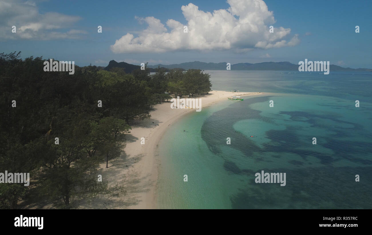 Aerial view of beautiful tropical beach with turquoise water in blue ...