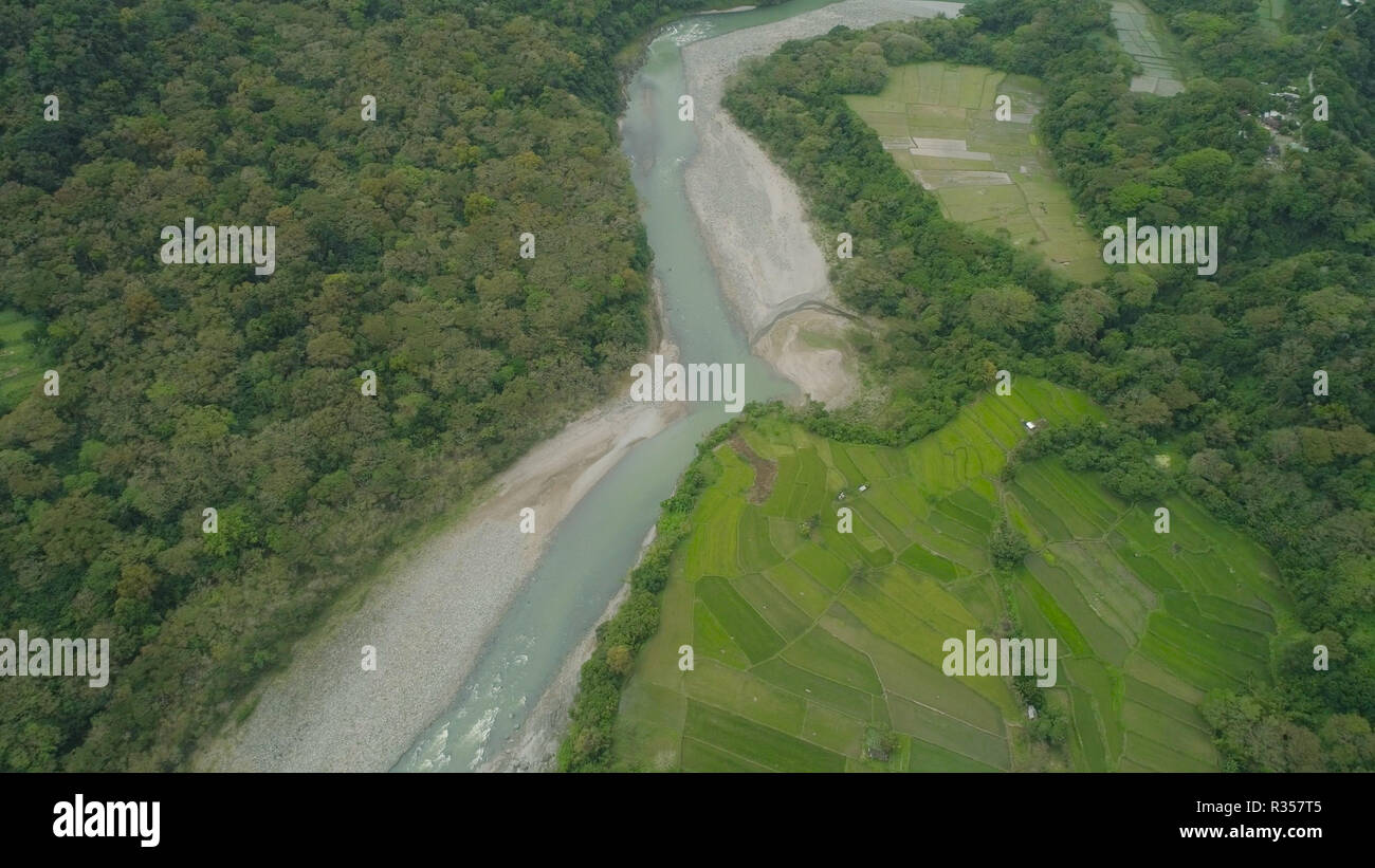 Aerial view of mountain valley in the cordillera, river, rice terraces ...